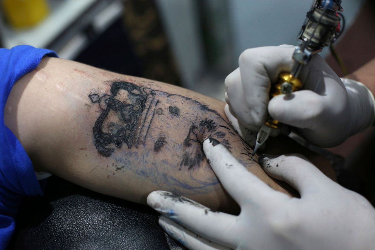 A tattoo at a time, Afghan woman takes on society’s taboos
