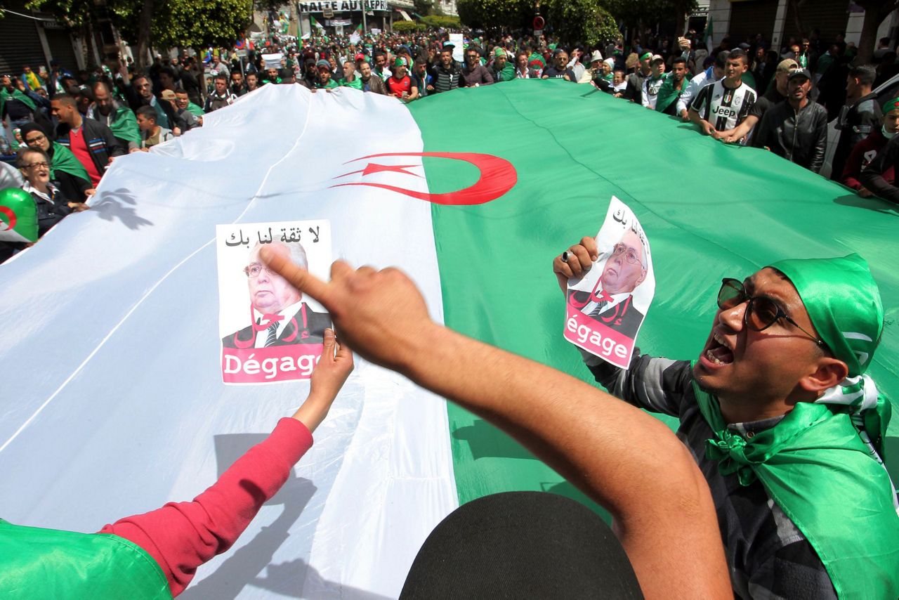 The Latest: Algerian police fire water cannon at protesters