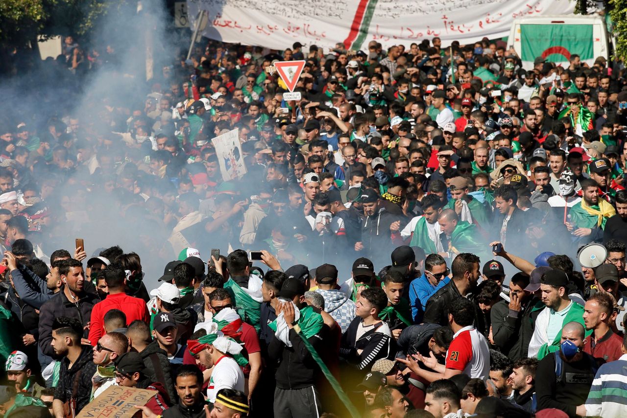 The Latest: Algerian police fire water cannon at protesters