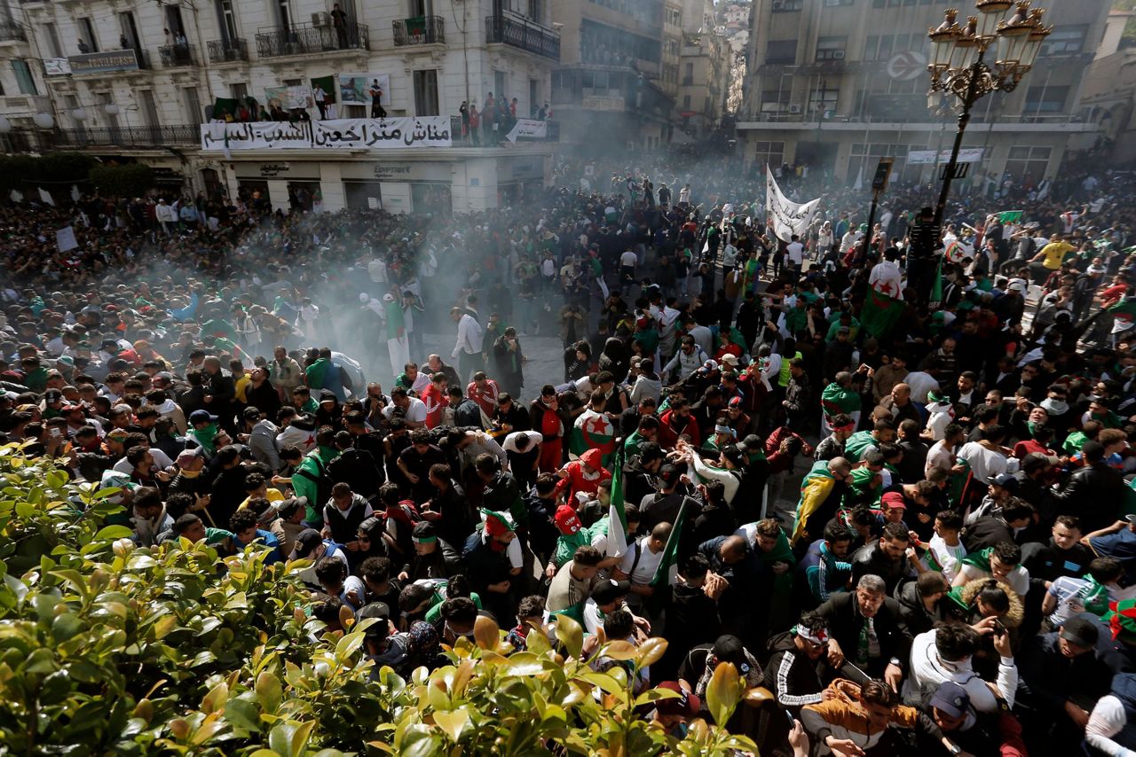 The Latest: Algerian police fire water cannon at protesters