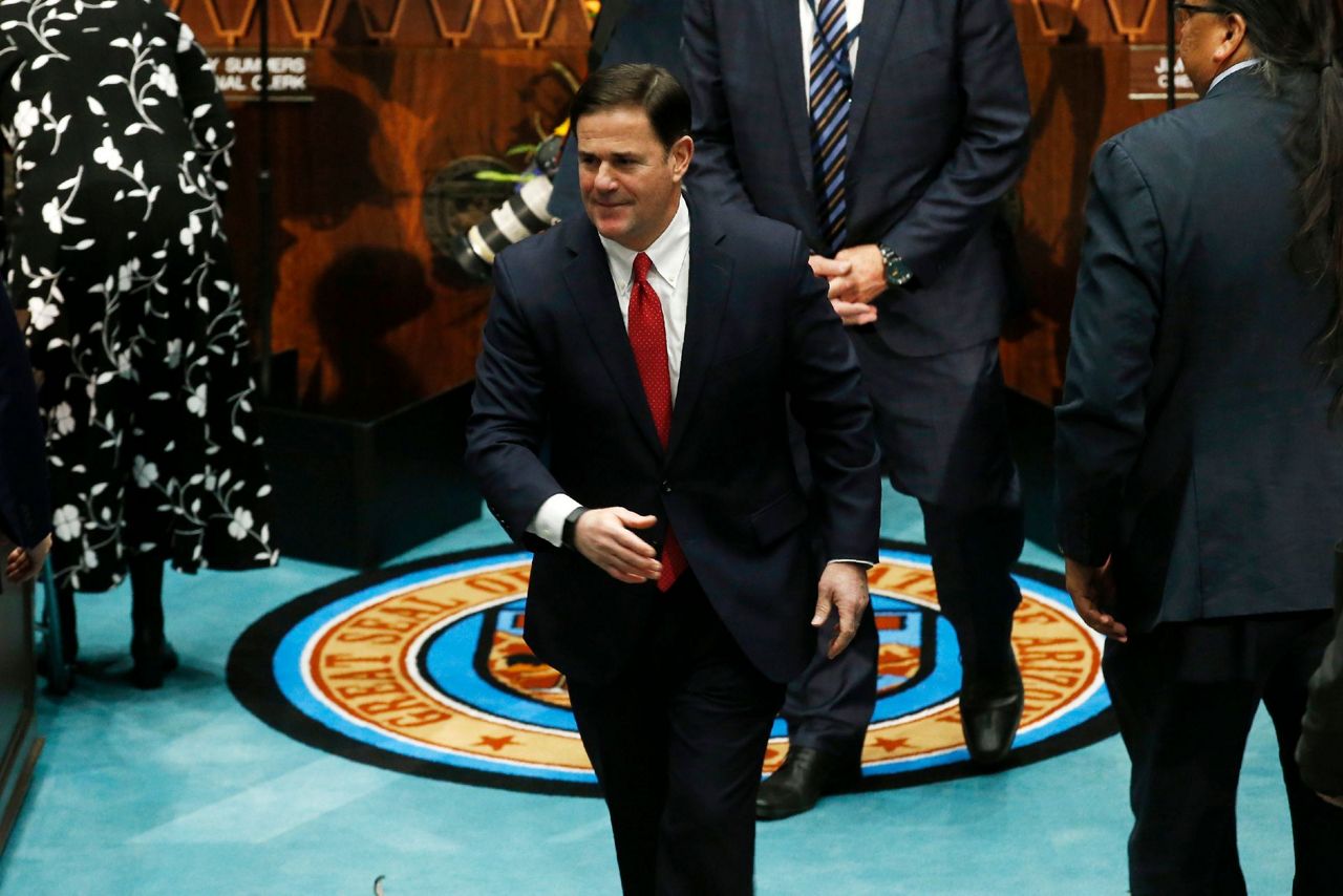 Arizona governor pulls immigration plan amid business revolt