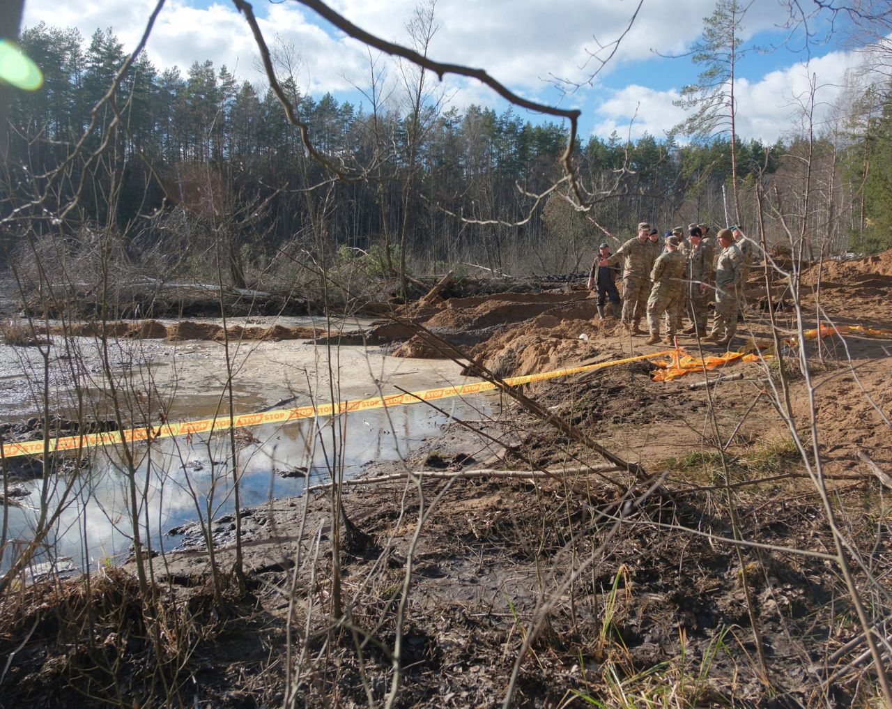US and Lithuanian forces struggle to drain swamp to recover 4 soldiers in submerged armored vehicle