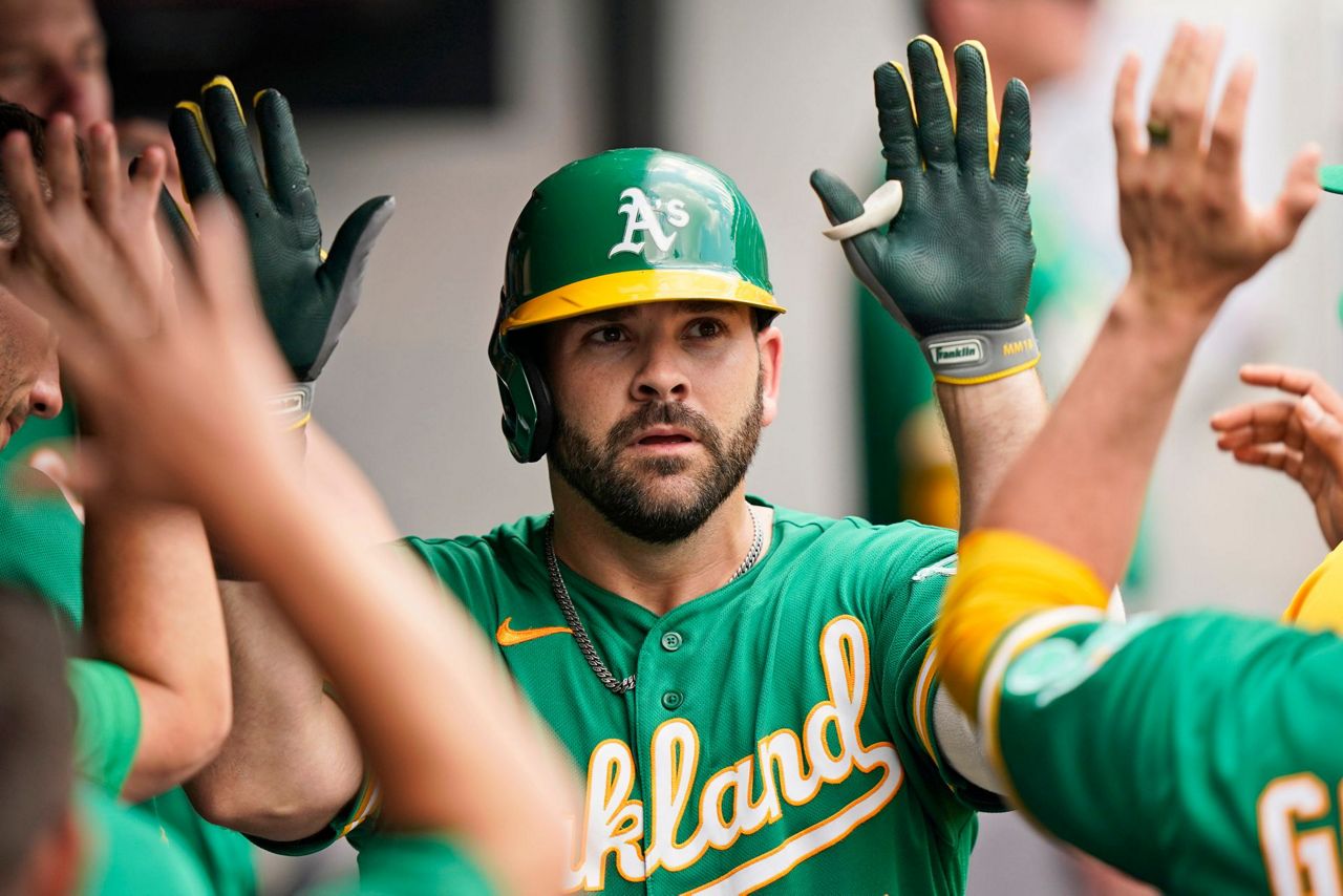 Moreland 2 HRs, Bassitt AL-high 12th W, A's bop Indians 17-0