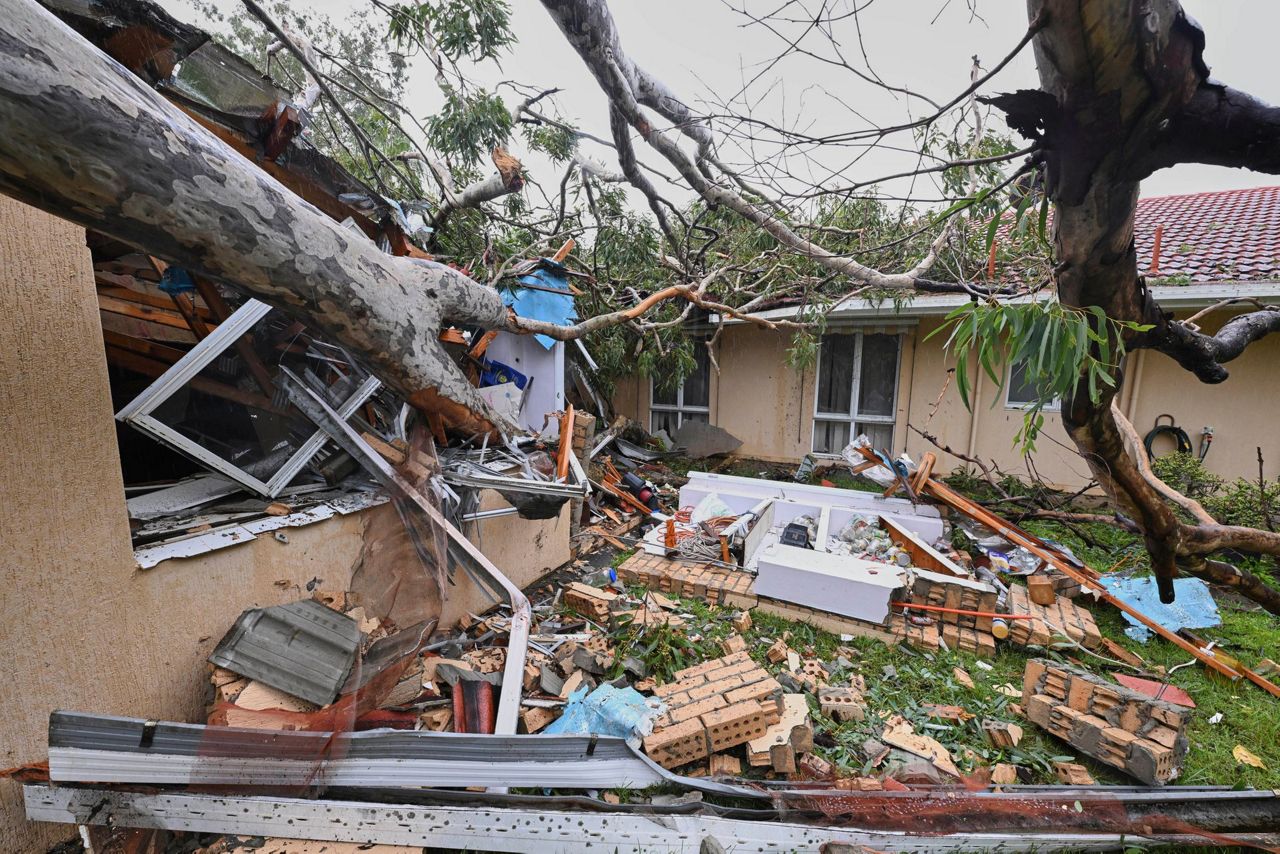 Australian homes lose power and people evacuate as tropical cyclone ...