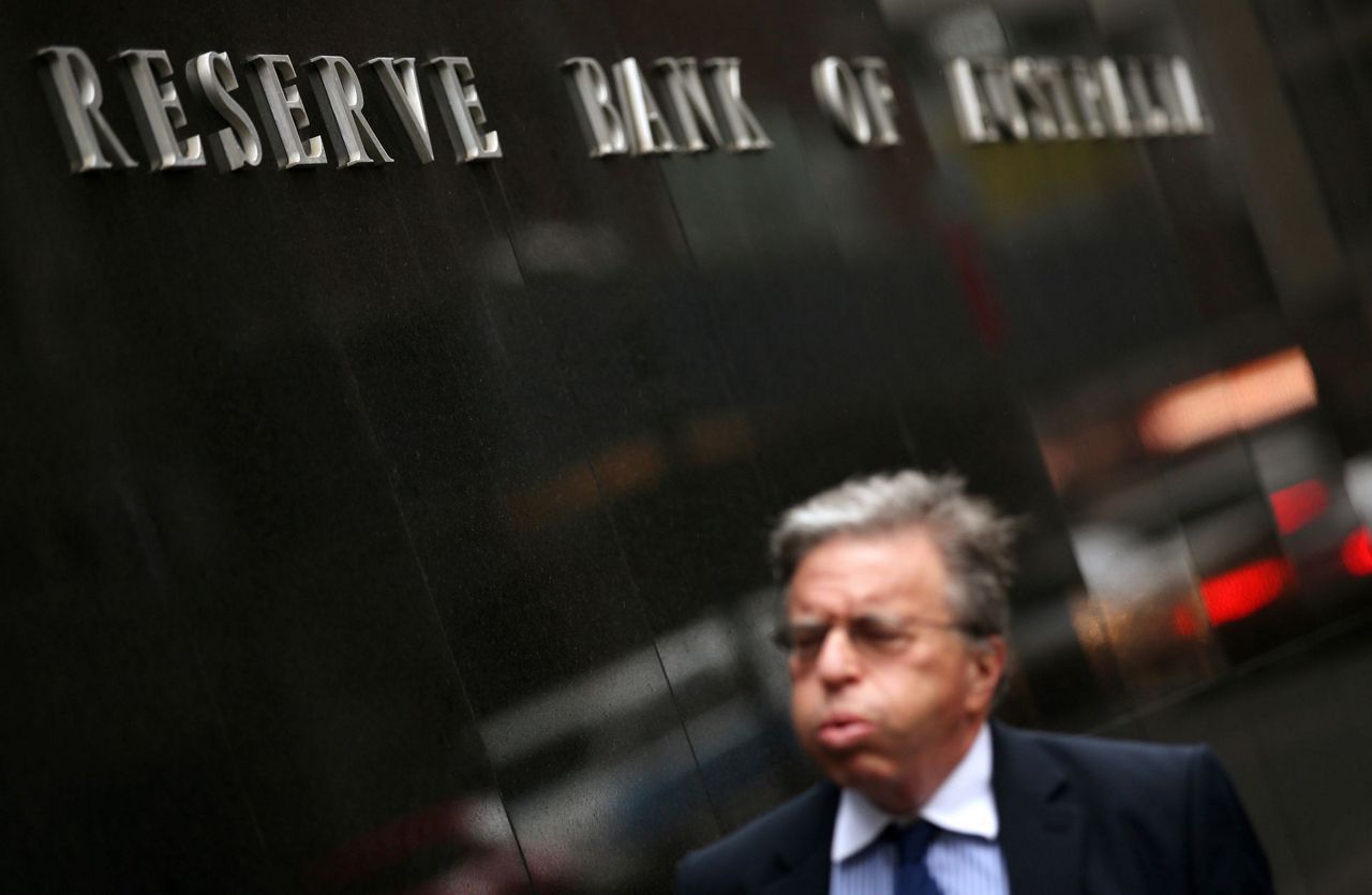 Australian central bank cuts benchmark interest rate for the first time ...