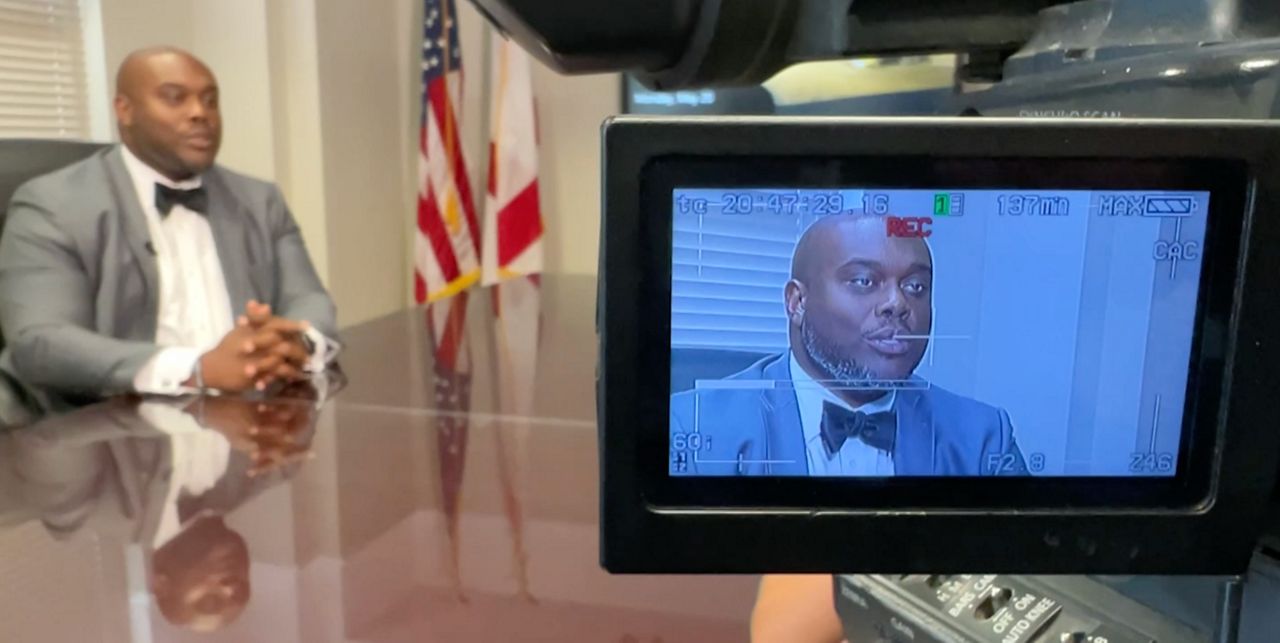 Andrew Bain launches program to tackle literacy rates