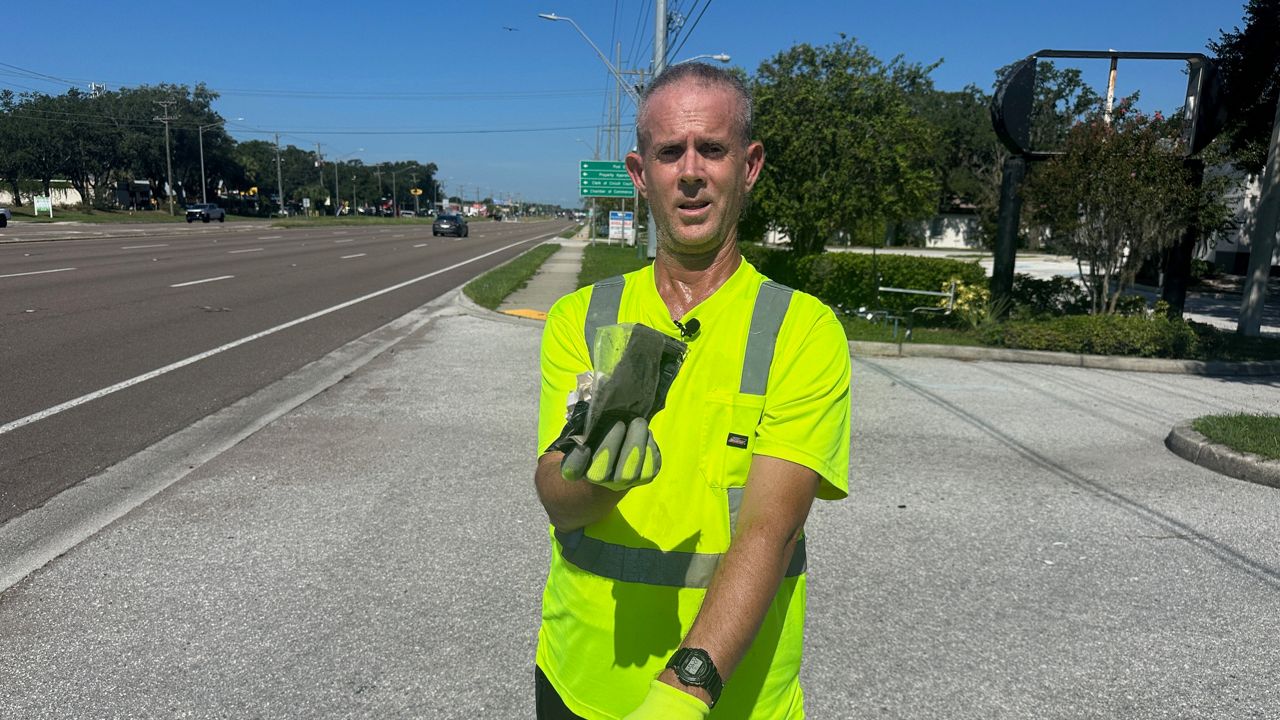 Michael McCloskery picks up roadside litter in Brandon