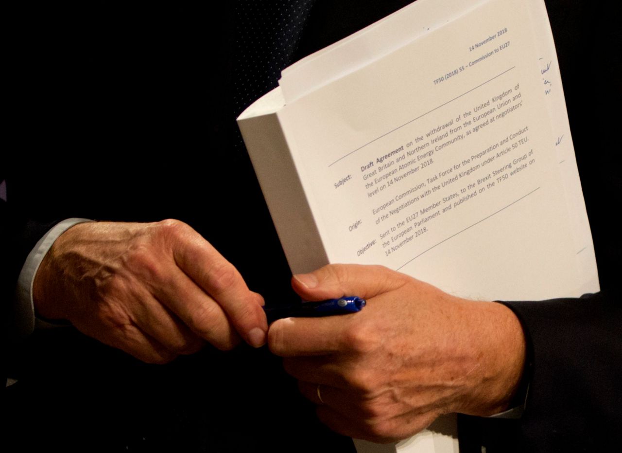 The Latest: May says Brexit draft is a step forward