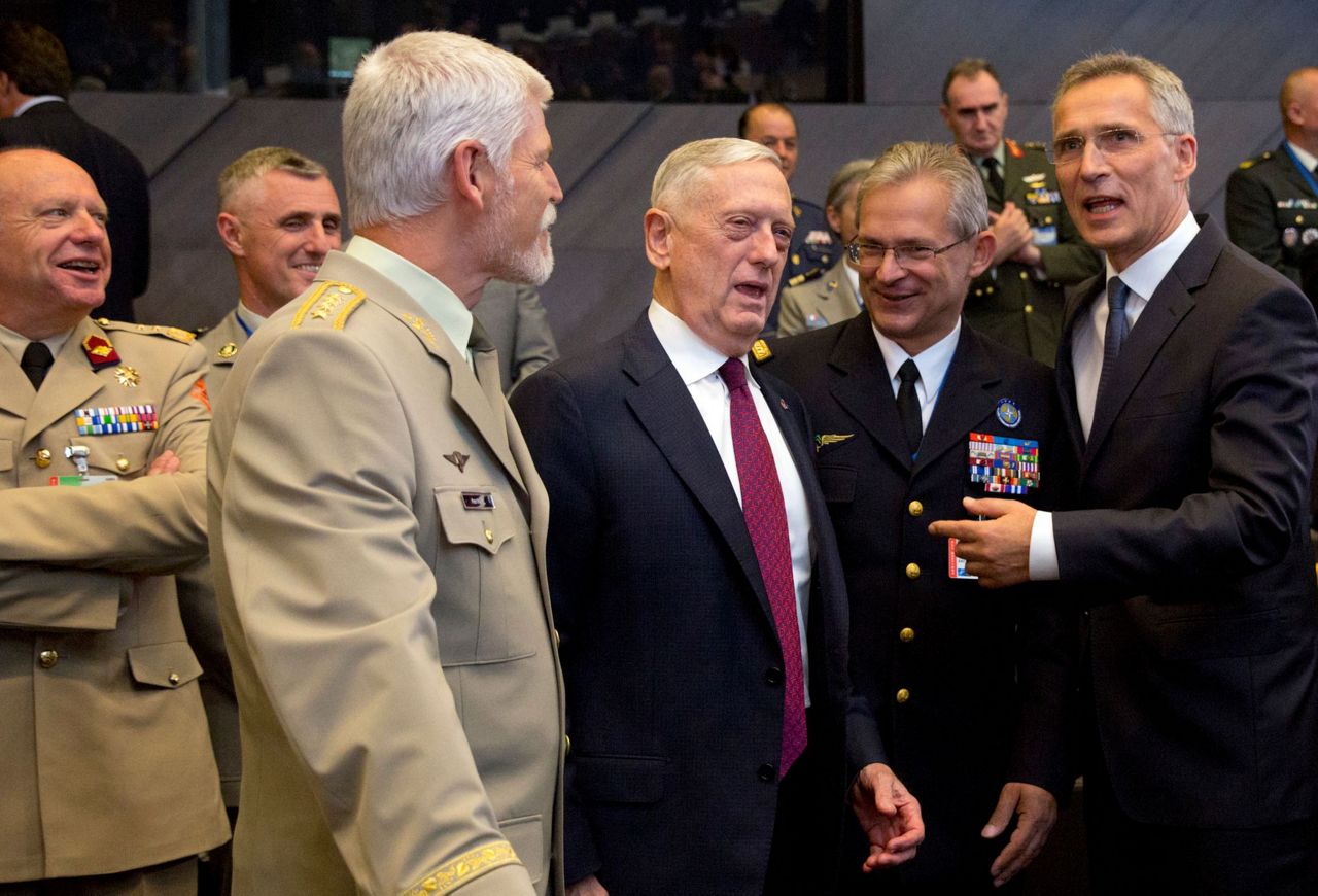 NATO meets to show resolve over Russia, paper over divisions