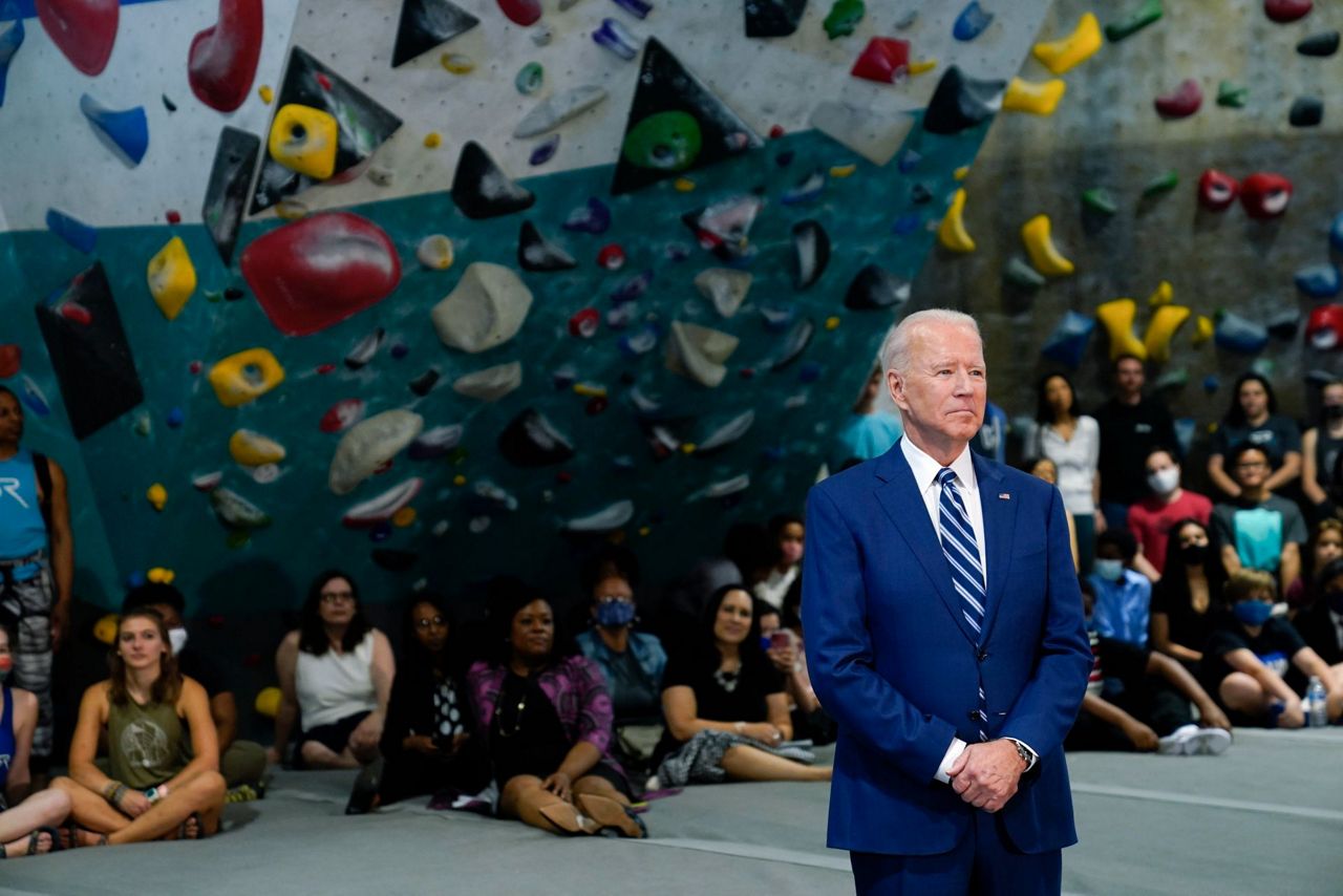 Biden starts holiday weekend by marking progress on virus