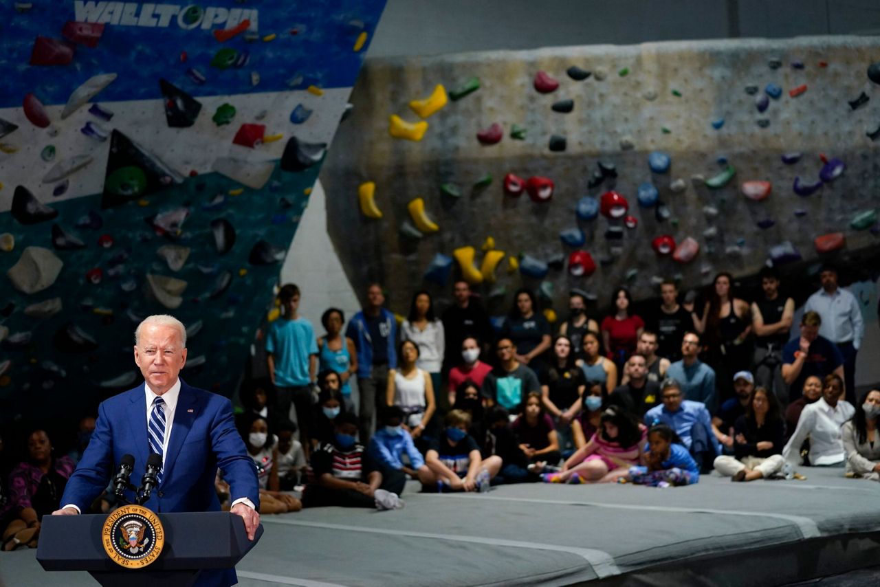 Biden starts holiday weekend by marking progress on virus