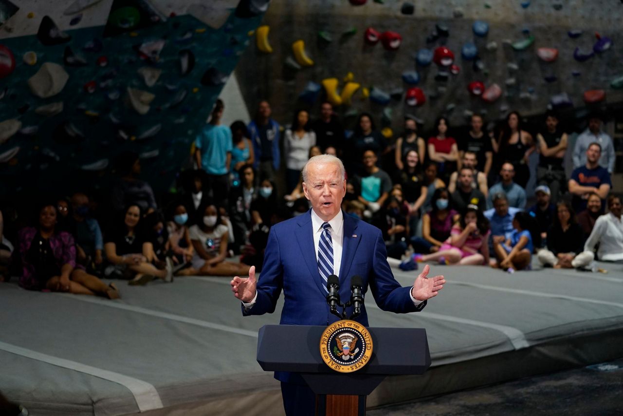 Biden starts holiday weekend by marking progress on virus