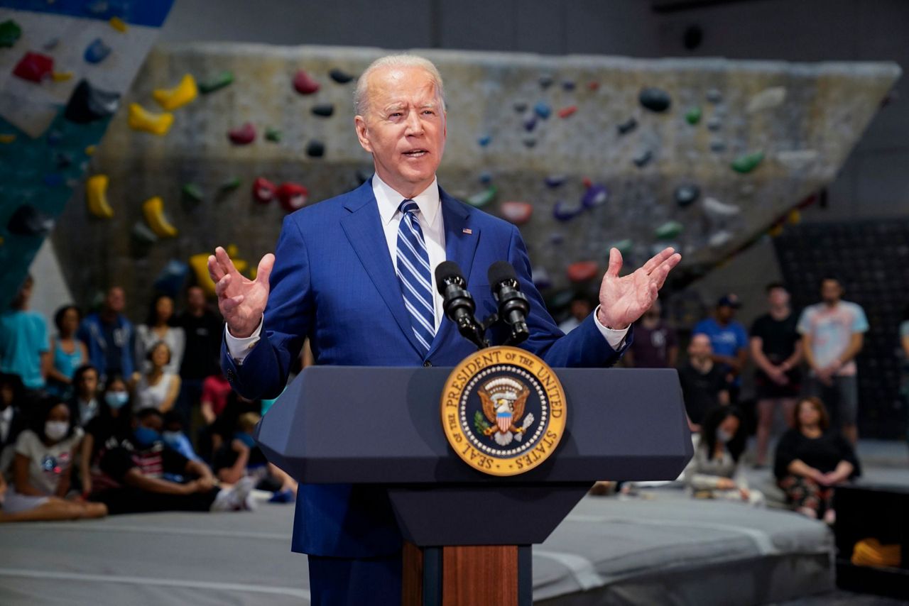 Biden starts holiday weekend by marking progress on virus