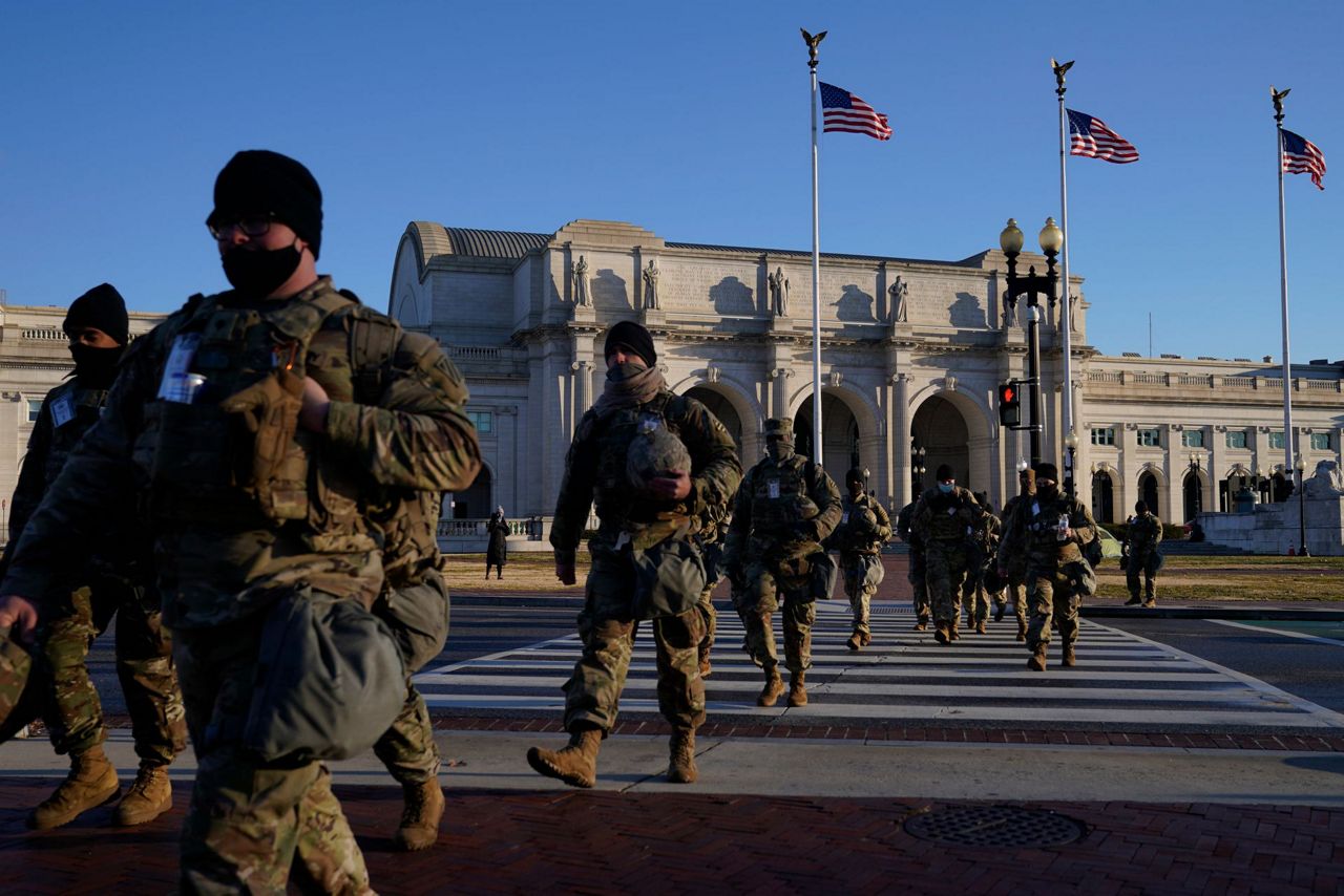 The Latest: Flags, signs, soldiers ahead of Biden inaugural