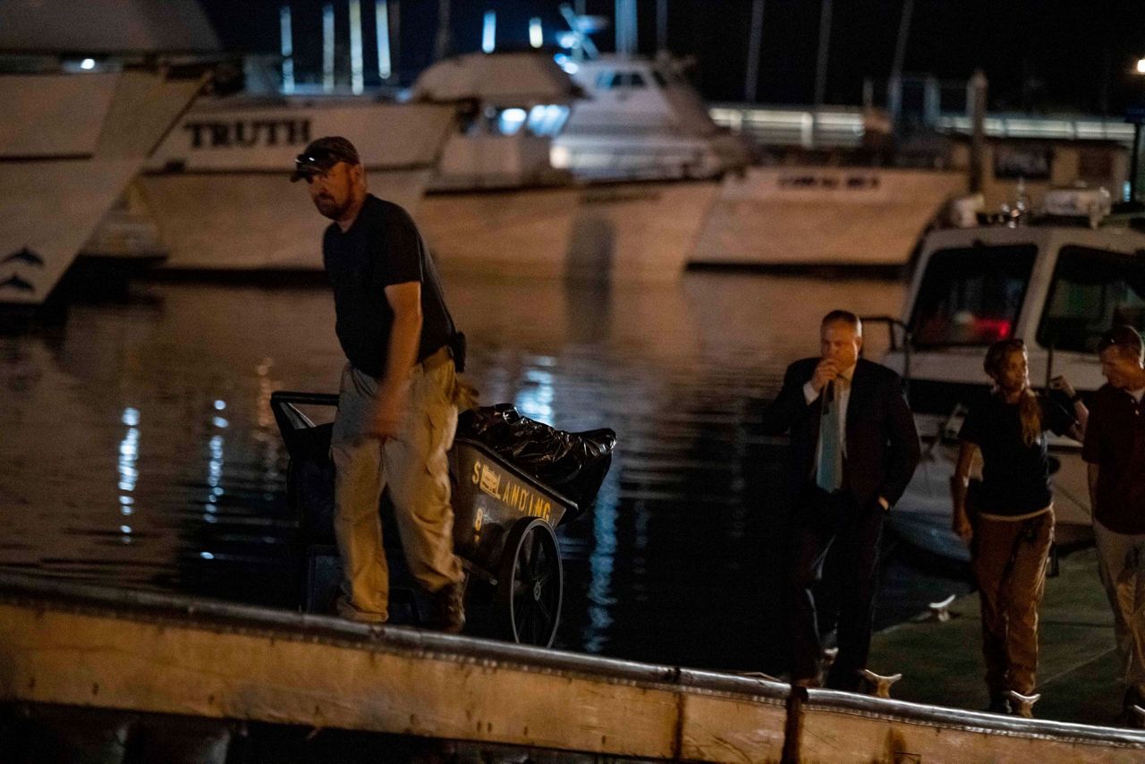Burning boat takes clues of fatal fire down to watery grave