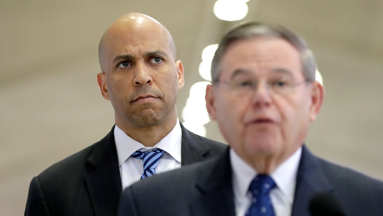 After hesitating, Cory Booker calls on Menendez to resign