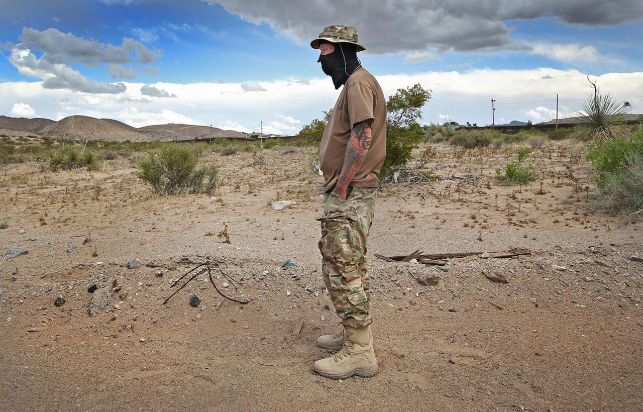 Authorities keep distance, yet work with armed border group