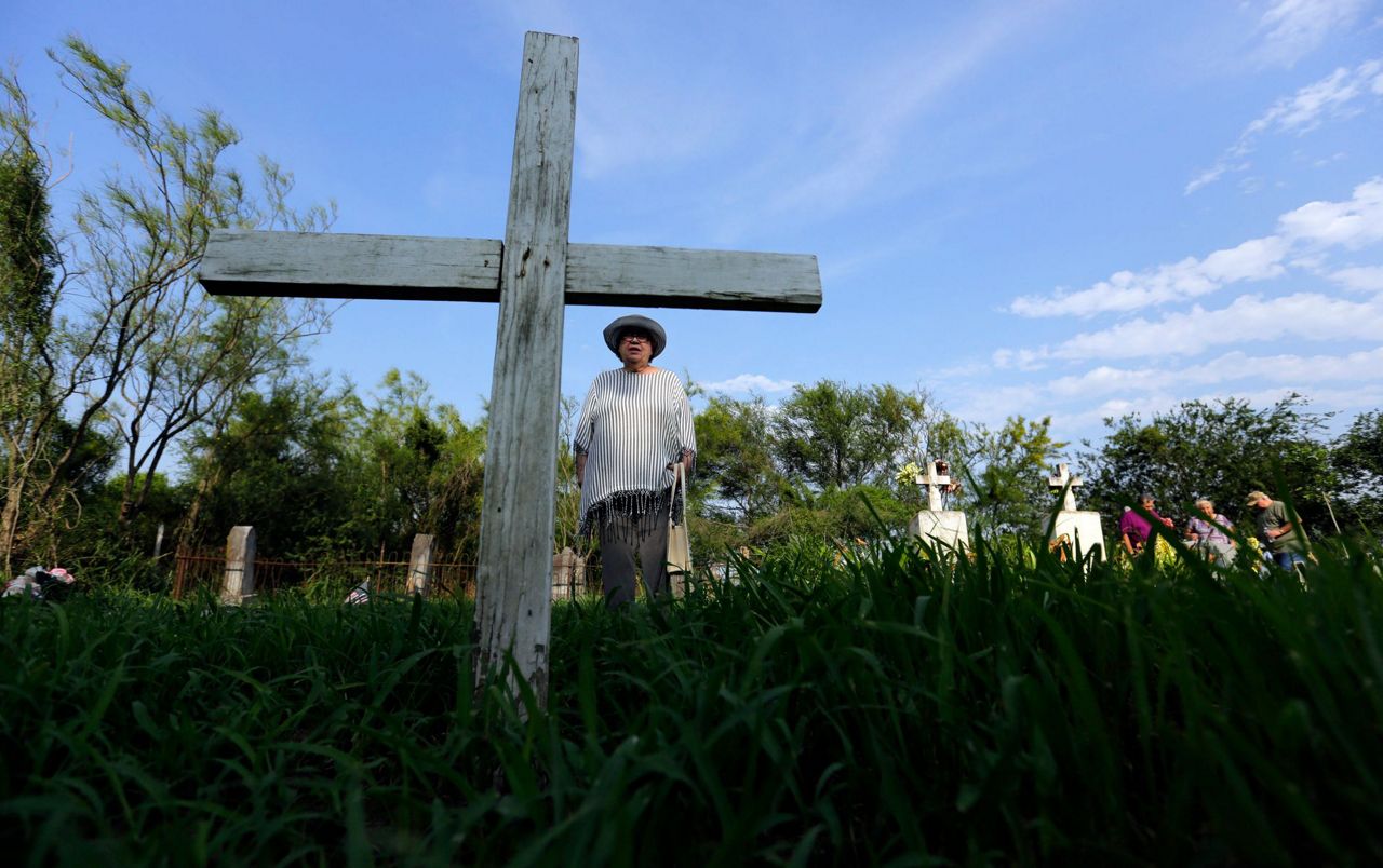 Cemeteries and family memories stand in border wall's way
