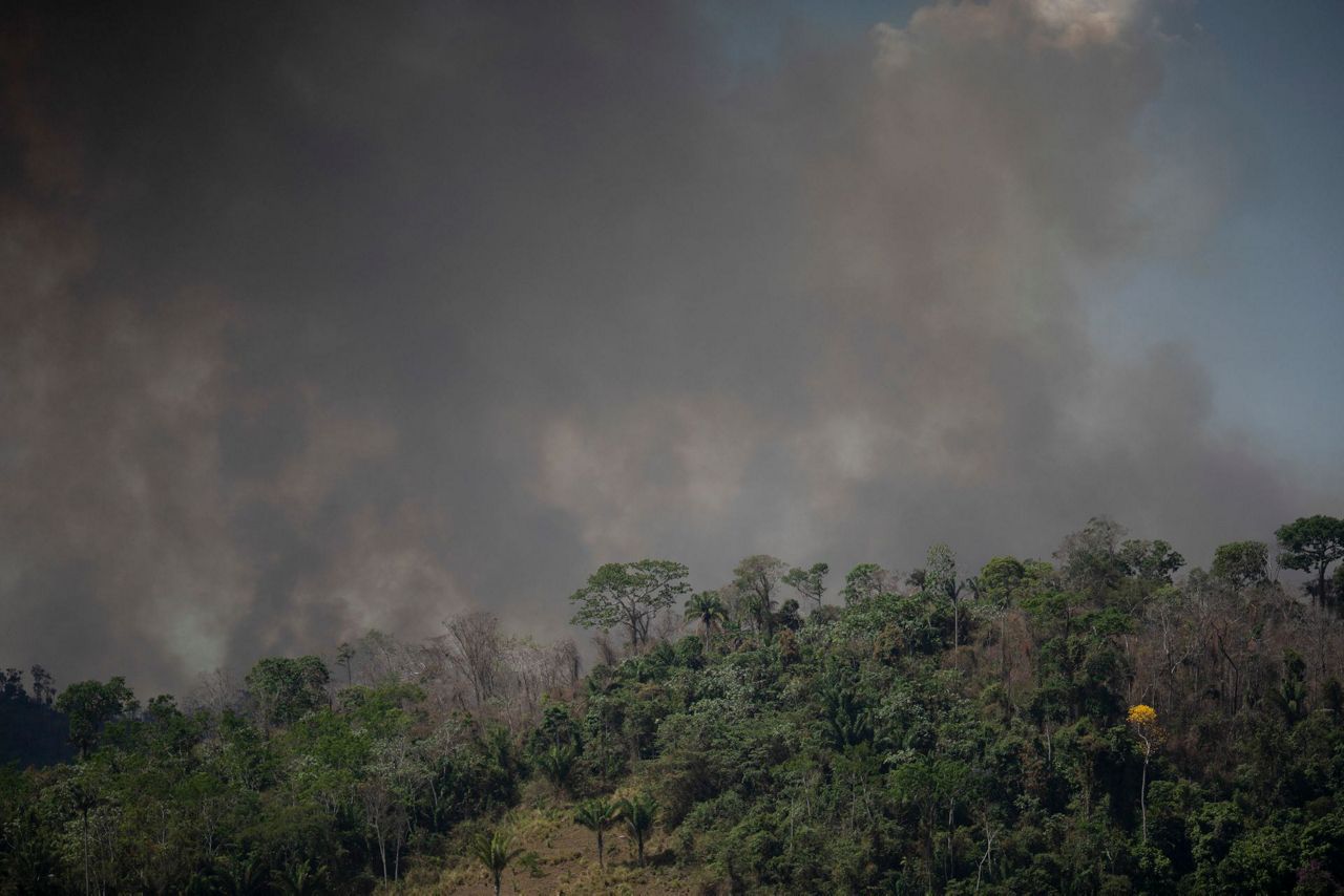 Brazilian firefighters toil in Amazon region hazy with smoke