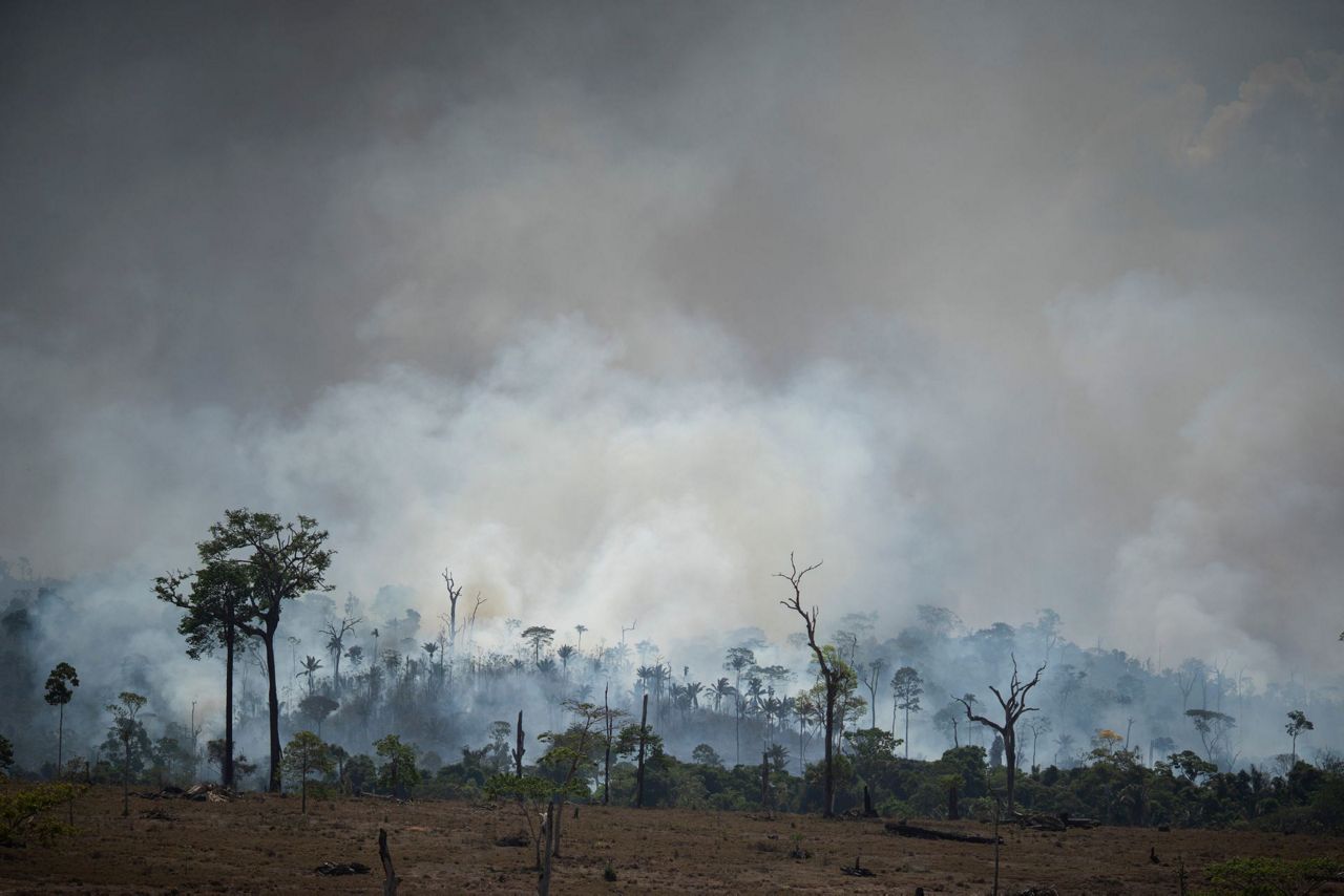 Brazilian firefighters toil in Amazon region hazy with smoke