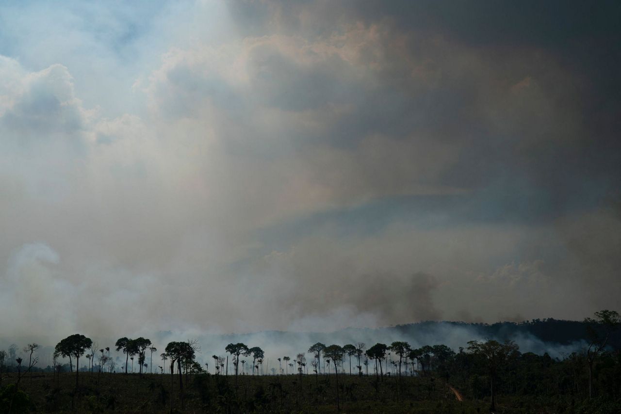 Brazilian firefighters toil in Amazon region hazy with smoke