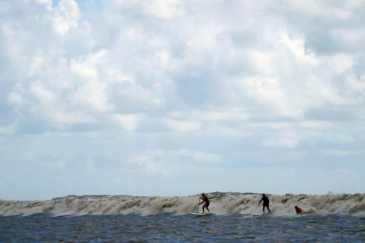 Surfers at Amazon's mouth ride some of world's longest-lasting waves