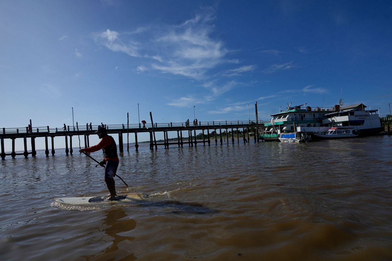 Surfers at Amazon's mouth ride some of world's longest-lasting waves