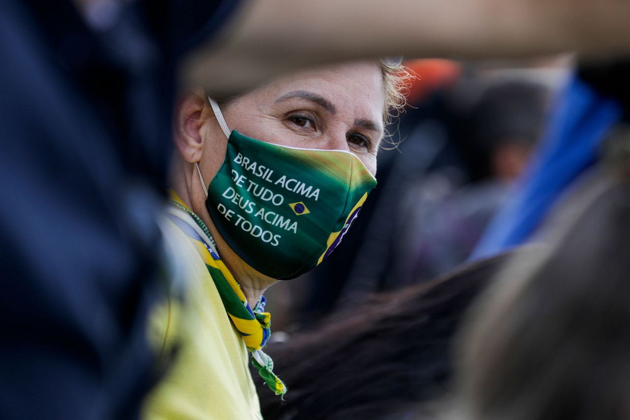 Bolsonaro fined as he flouts mask rule before motorcyclists