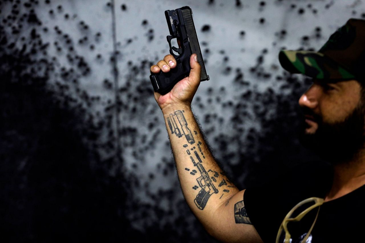 Brazil's Bolsonaro moves to arm base, alarming gun experts