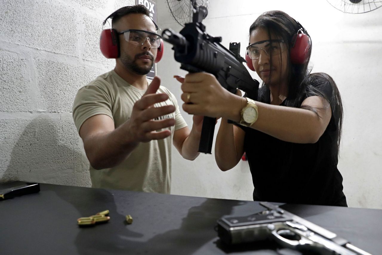 Brazil's Bolsonaro moves to arm base, alarming gun experts