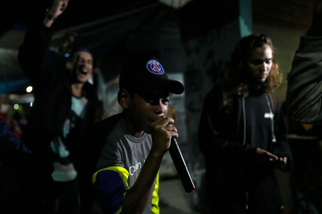 In Brazil favela, rap battle is sign of returning normality