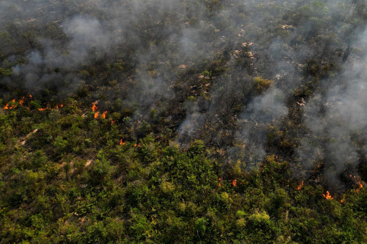 Brazil’s firefighters battle wildfires raging during rare late-winter ...