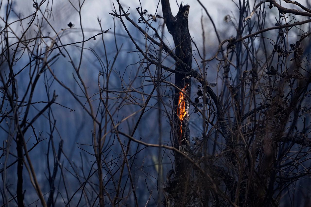 Brazil’s firefighters battle wildfires raging during rare late-winter ...
