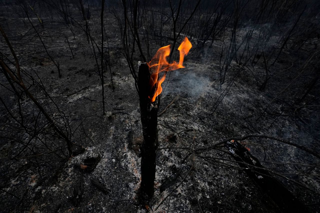 Brazil’s firefighters battle wildfires raging during rare late-winter ...