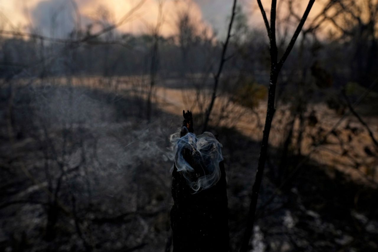 Brazil’s firefighters battle wildfires raging during rare late-winter ...