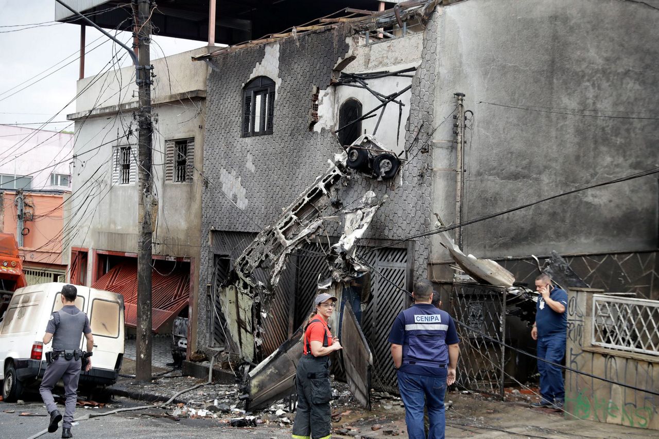 Plane crashes in Sao Paulo neighborhood, 2 dead, 12 injured