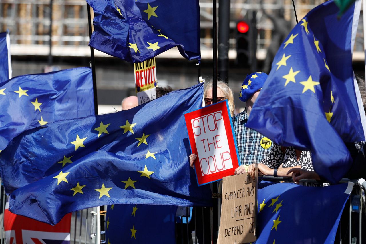 Defiant UK lawmakers move to bar 'no deal' Brexit