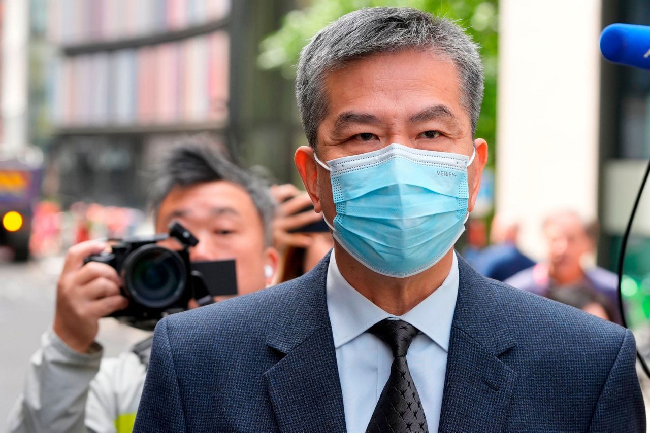 UK border official and former Hong Kong cop convicted of assisting ...
