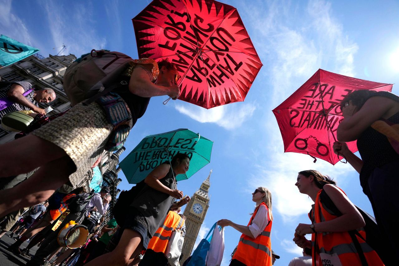 Protesters in UK decry climate change after record heat wave