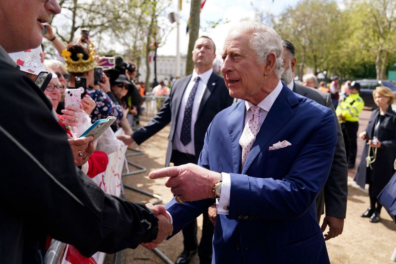 King Charles III surprises crowd outside Buckingham Palace