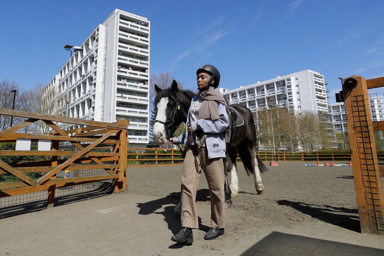 AP PHOTOS: London riding club inspires children to saddle up
