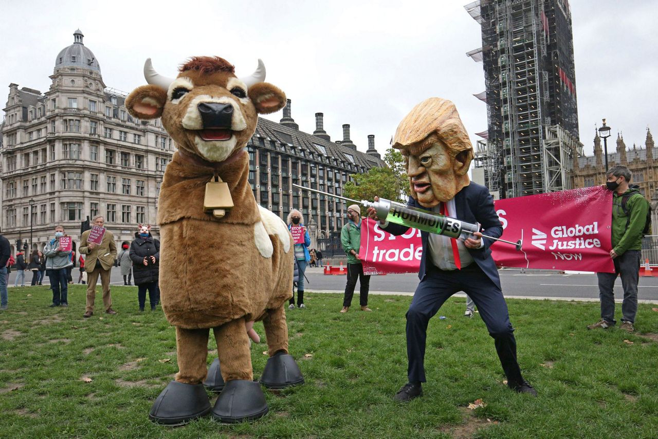 UK-US trade pact opposed with Trump, cows and pigs as props
