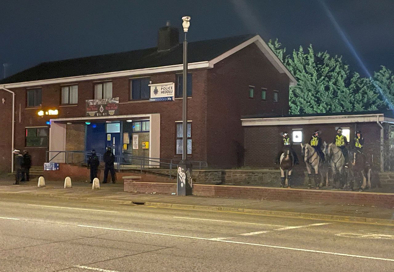 Cars set on fire in Welsh capital as police face 'large scale disorder'