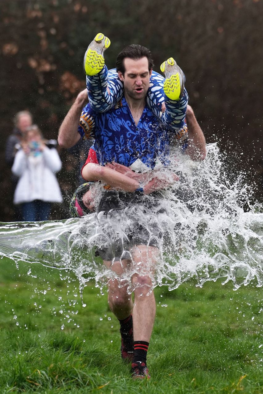Finnish pair wins a barrel of ale in annual 'wife-carrying' contest in ...