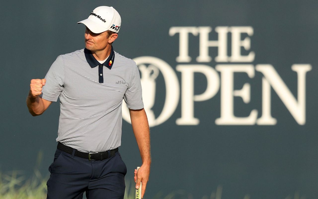 The Latest: No wind, good scoring early in British Open