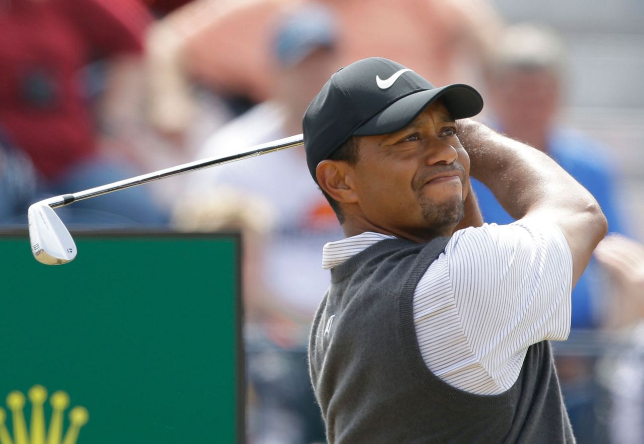 The Latest: No wind, good scoring early in British Open