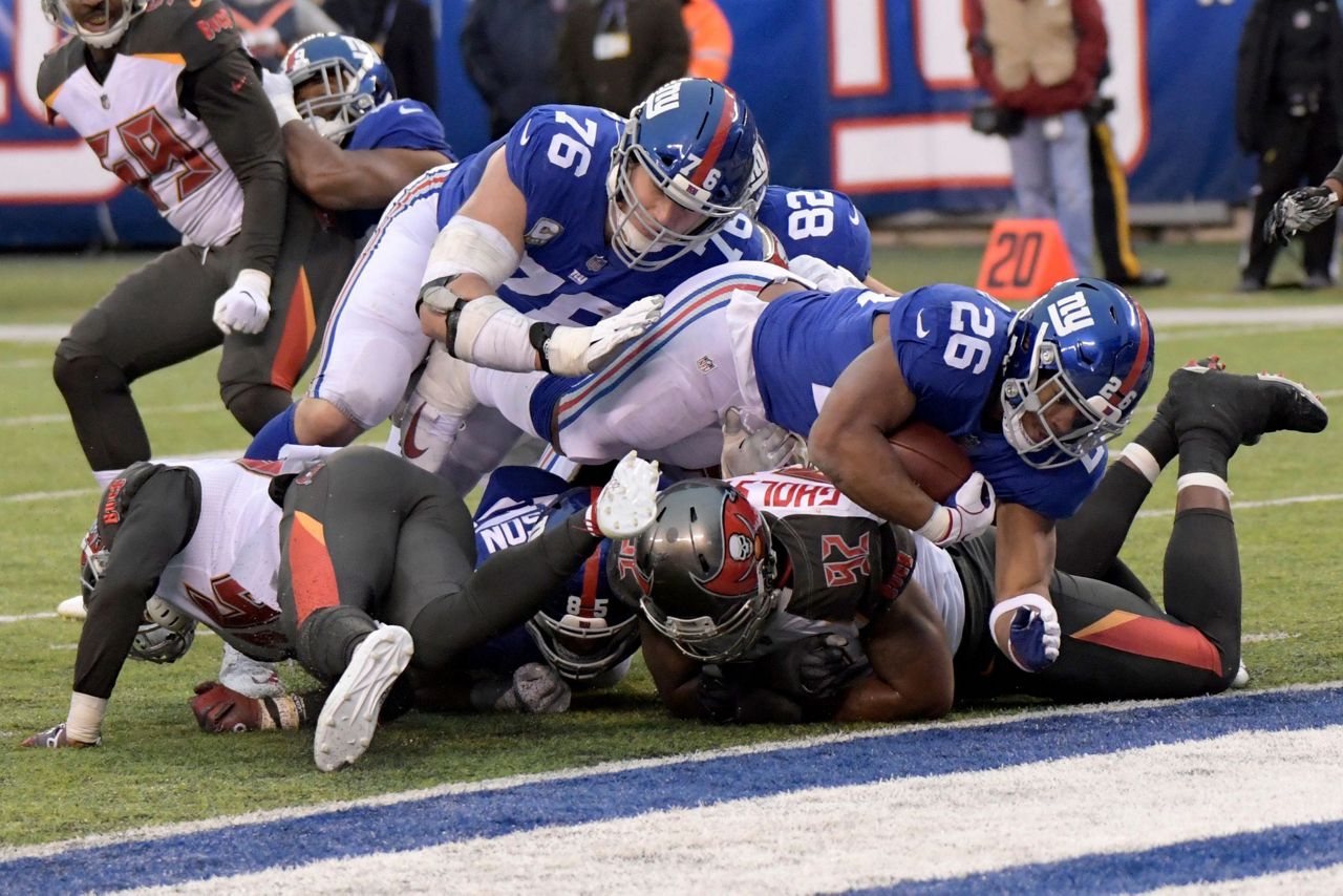 Barkley scores 3 TDs, Manning throws 2, Giants win again