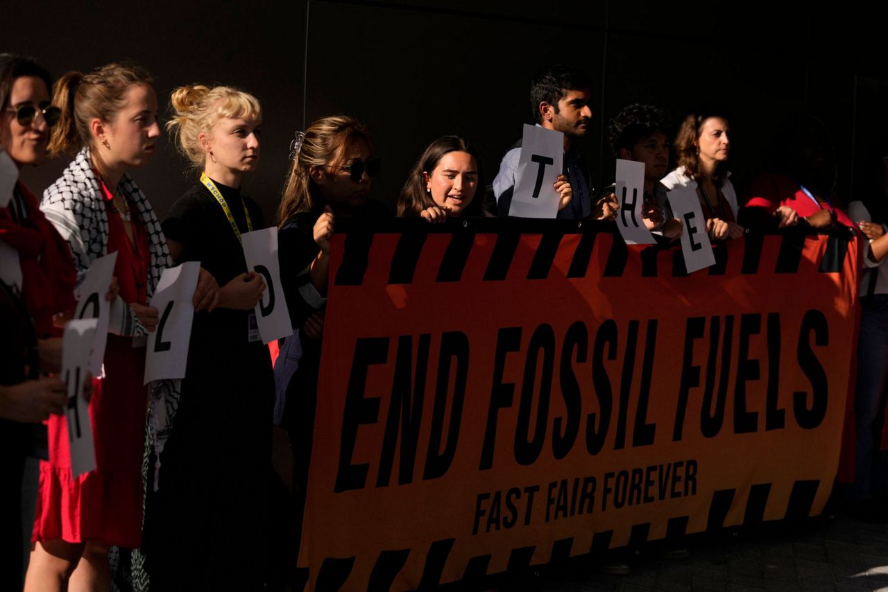 As COP28 negotiators wrestle with fossil fuels, activists urge them to ...