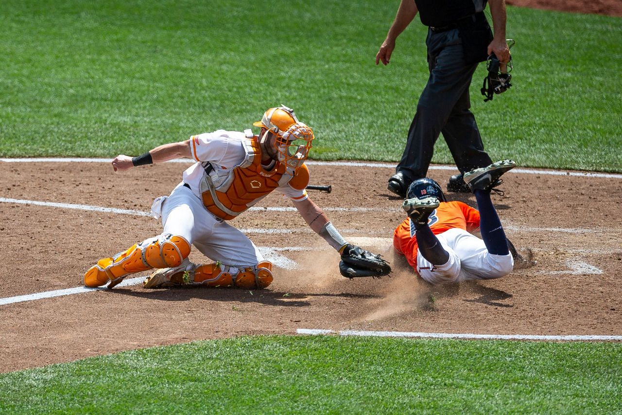 Michaels, Abbott lead Virginia past Vols 6-0 in CWS opener