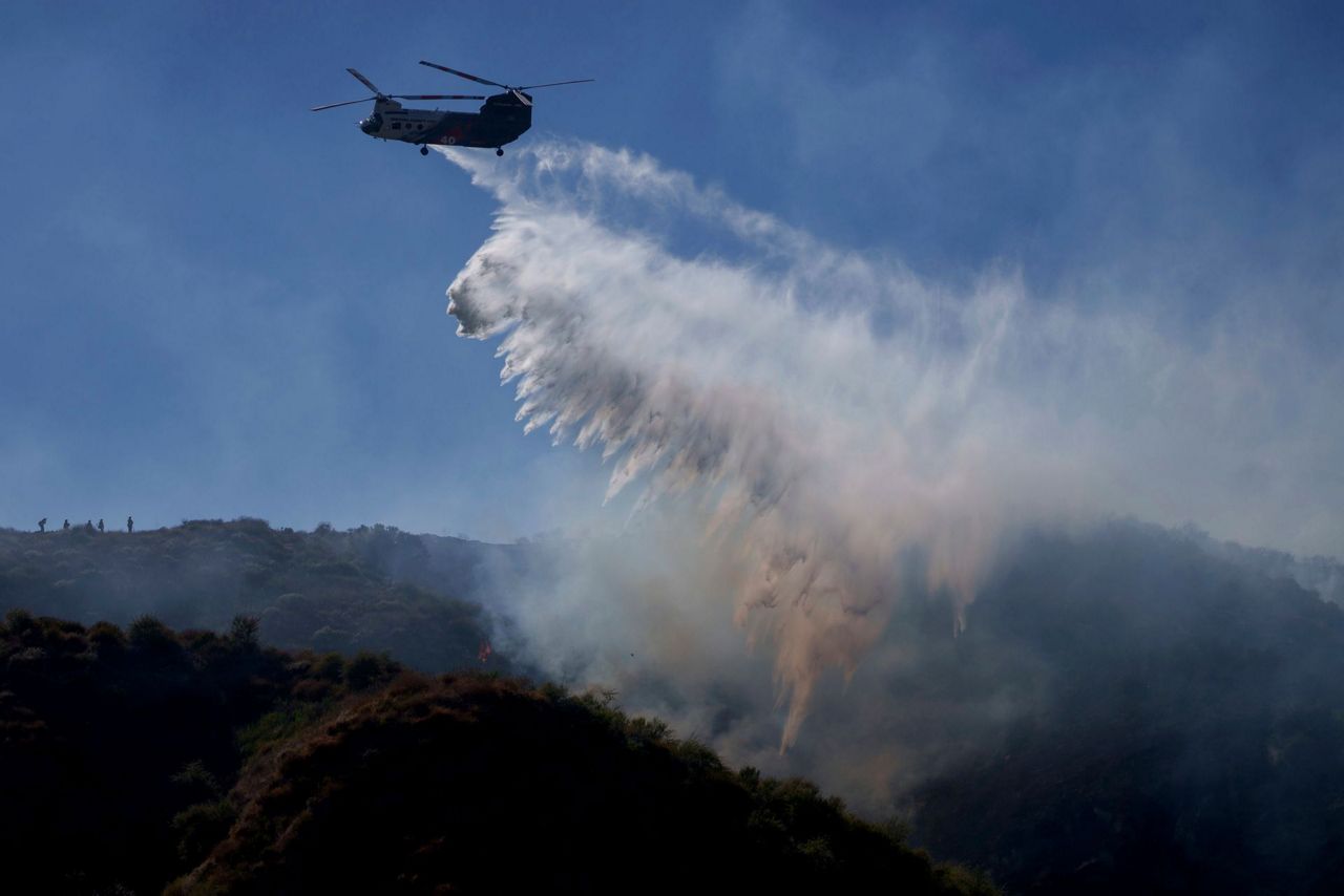Northern California wildfire spreads, with more hot weather expected ...